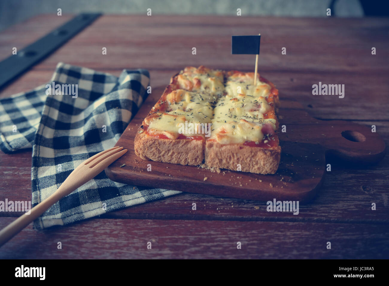 Pizza toasted bread with tomato sauce and ham cheese selective focus ...