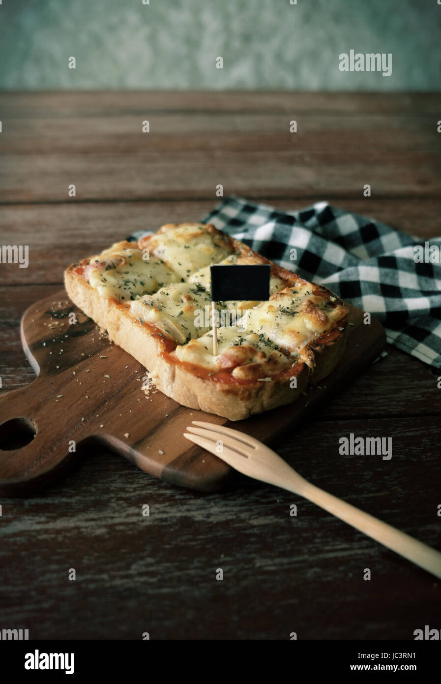Pizza toasted bread with tomato sauce and ham cheese selective focus ...