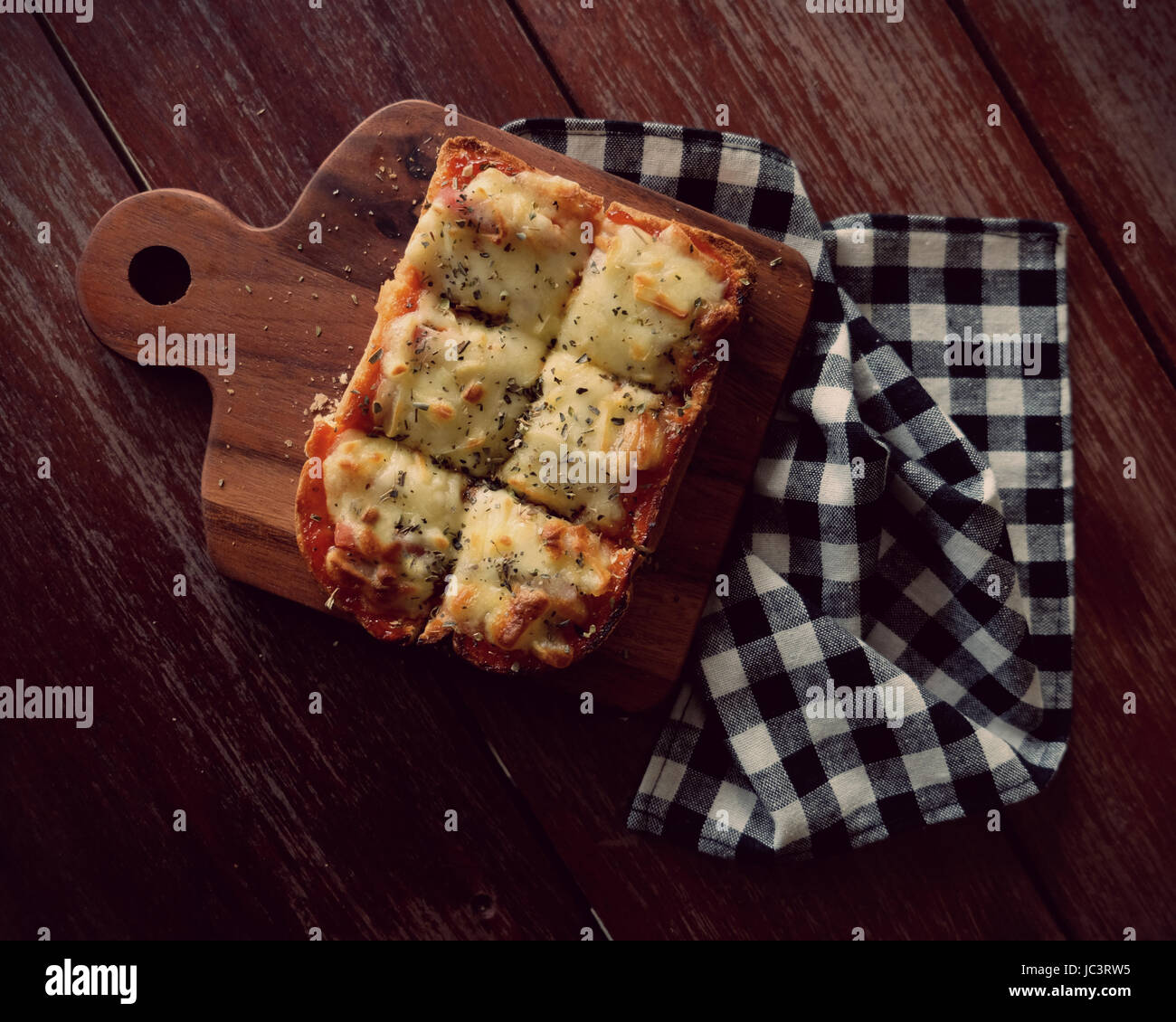 Pizza toasted bread with tomato sauce and ham cheese selective focus ...