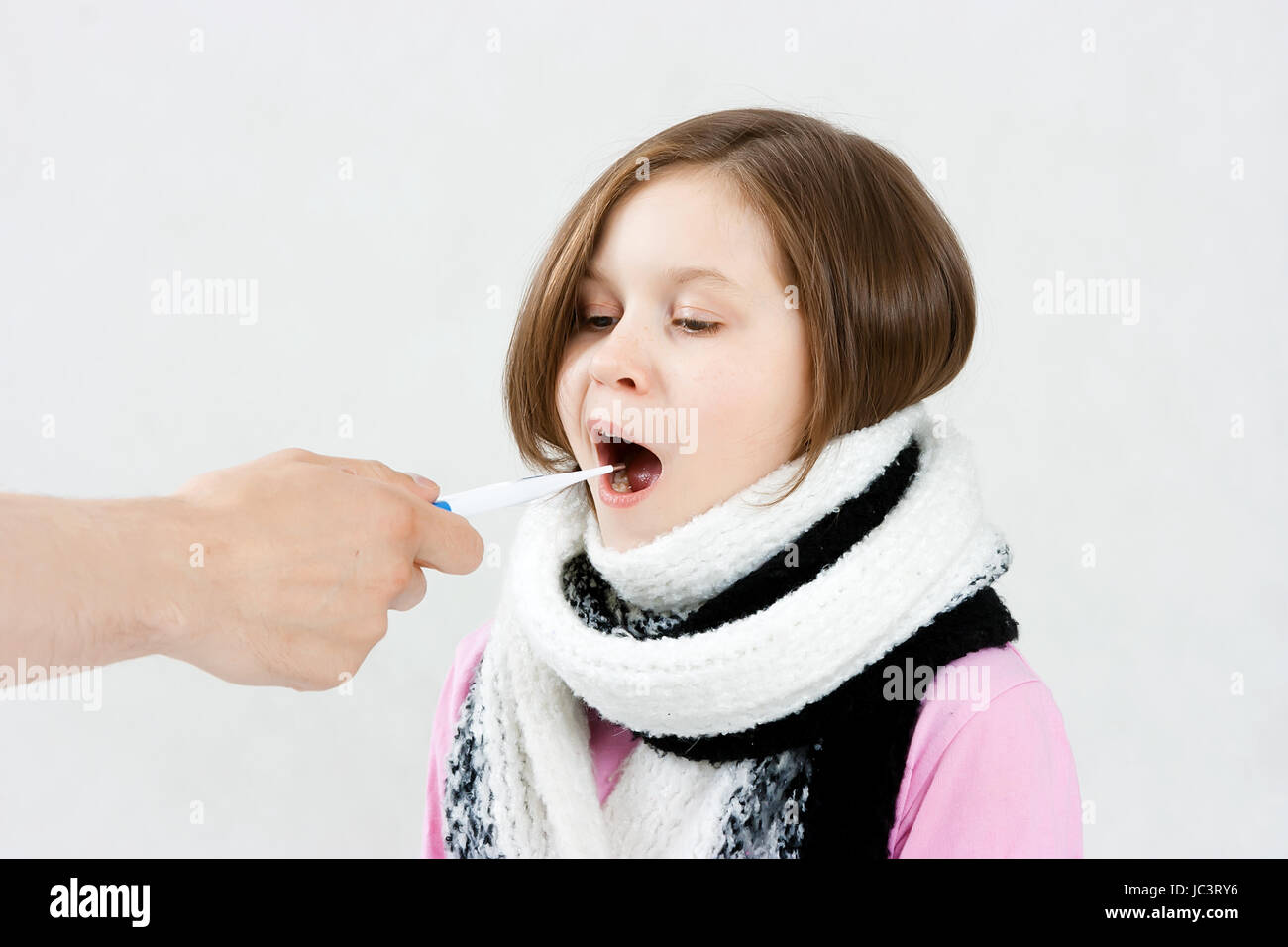 Teen girl is going to measure the temperature Stock Photo - Alamy