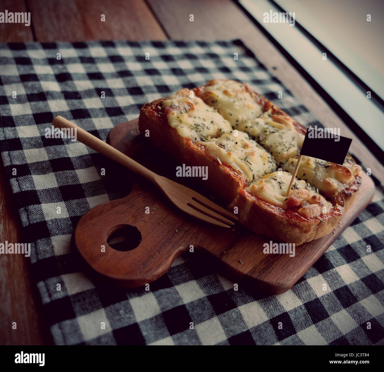 Pizza toasted bread with tomato sauce and ham cheese selective focus ...