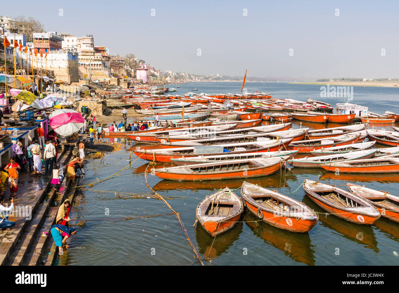 Many colorful rowing boats are tight up at Dashashwamedh Ghat, Main ...