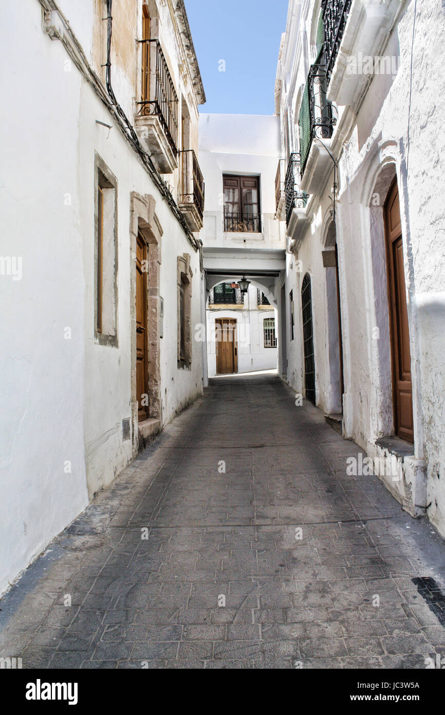 A typical Andalusian street with whitewashed houses. Nijar, a village ...