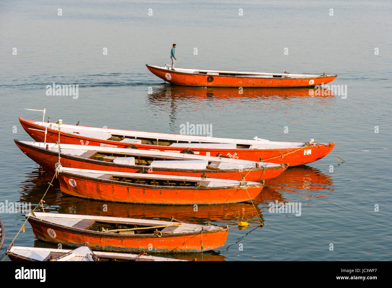 Many colorful rowing boats are tight up at Dashashwamedh Ghat, Main ...