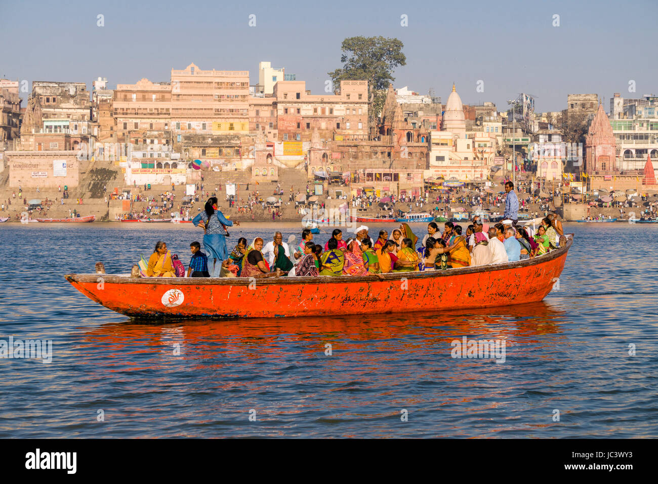 Pilgrims are taking bath and pray on the sand banks at the holy river ...
