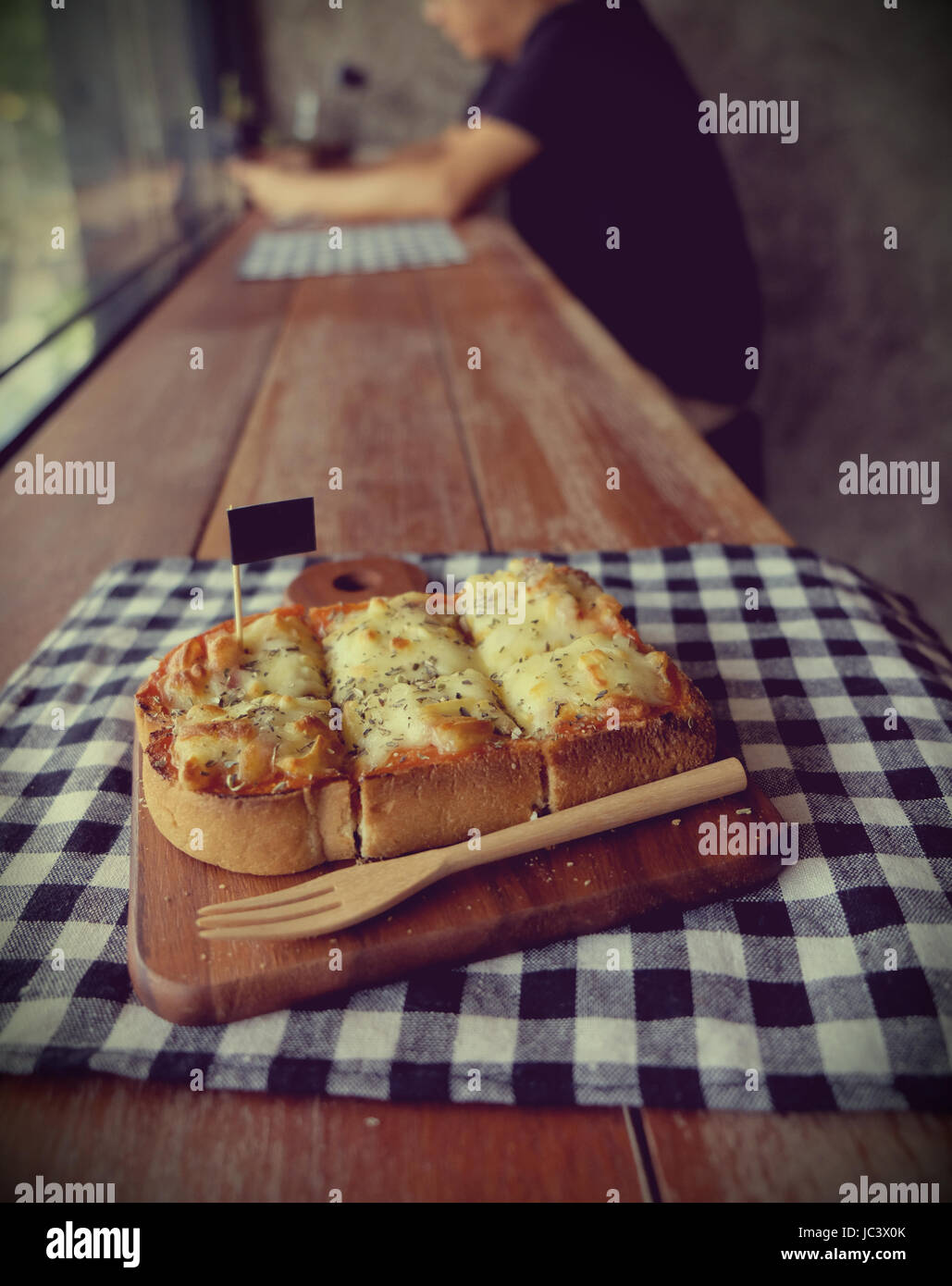 Pizza toasted bread with tomato sauce and ham cheese selective focus ...