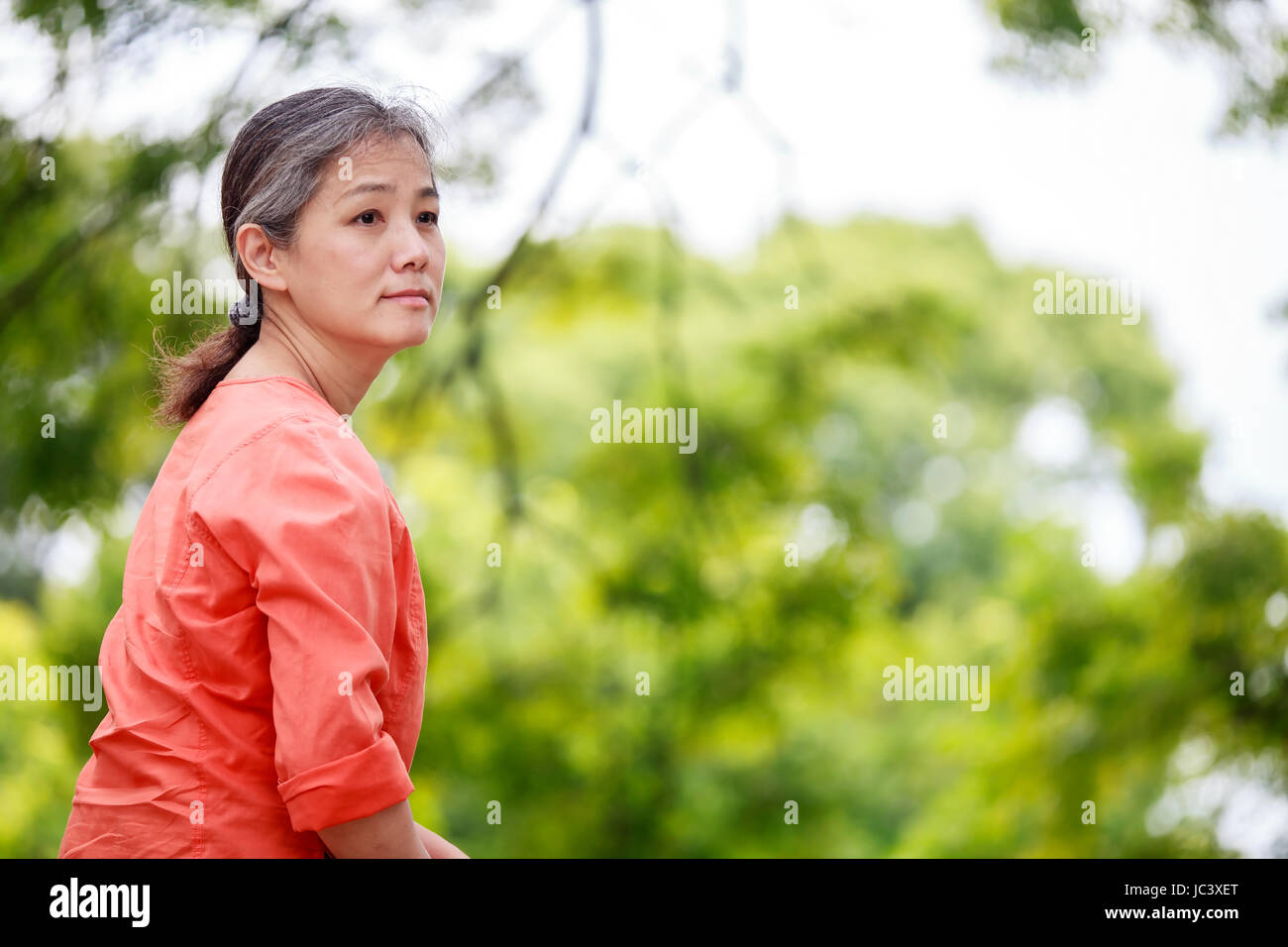 Portrait of serene mature woman in garden for adv or others purpose use Stock Photo - Alamy