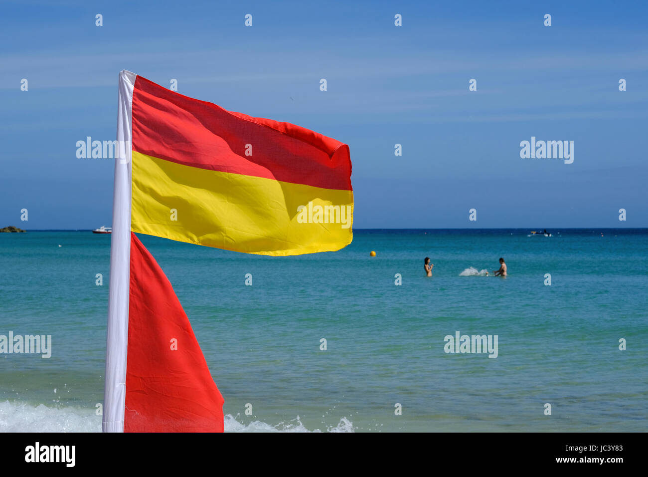 Lifeguard safety flags on the beach at St Ives, Cornwall Stock Photo ...