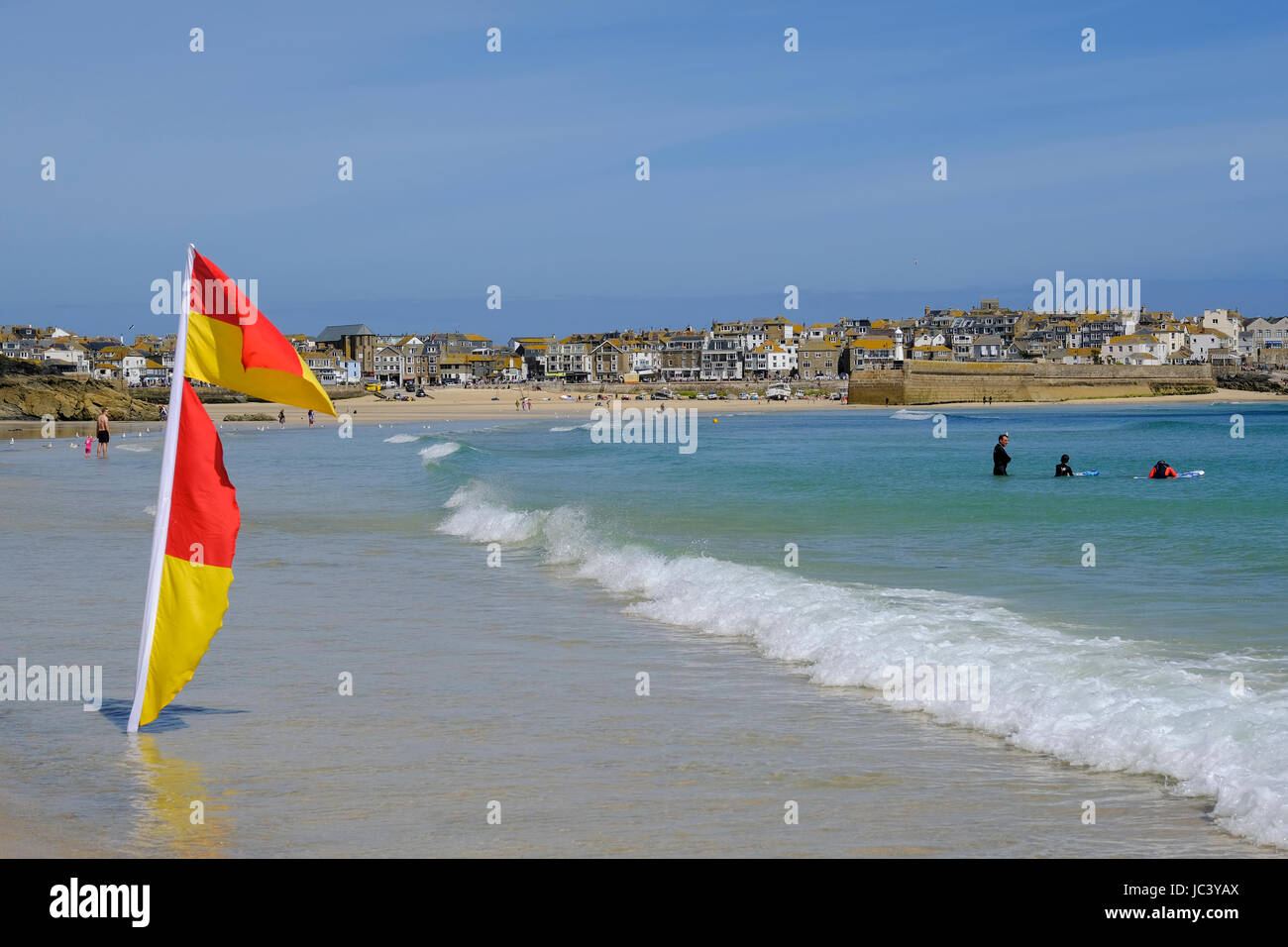 Lifeguard safety flags on the beach at St Ives, Cornwall Stock Photo ...