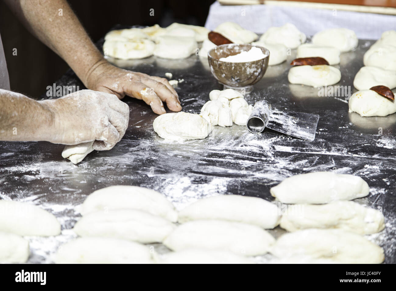 Baker working, detail of a traditional bakery, healthy and everyday ...