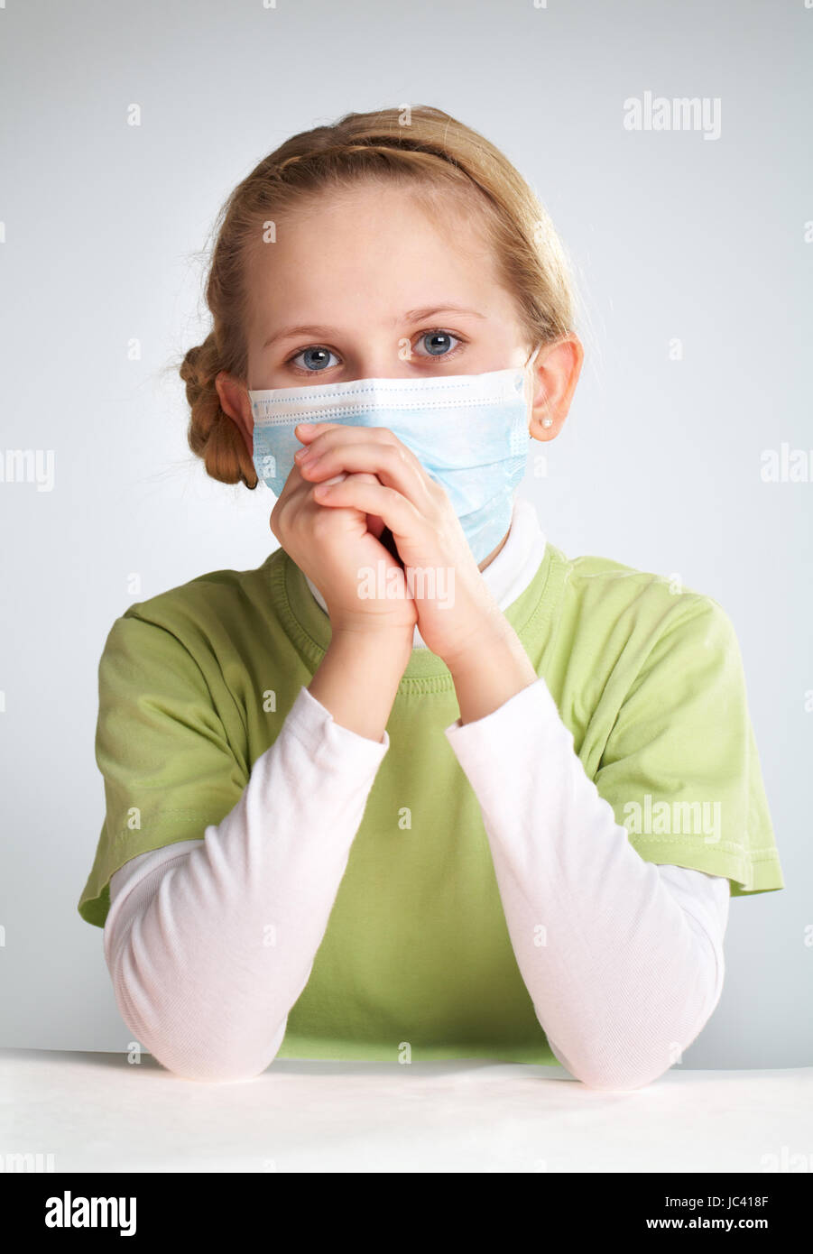 Portrait of a sad girl in face mask Stock Photo - Alamy