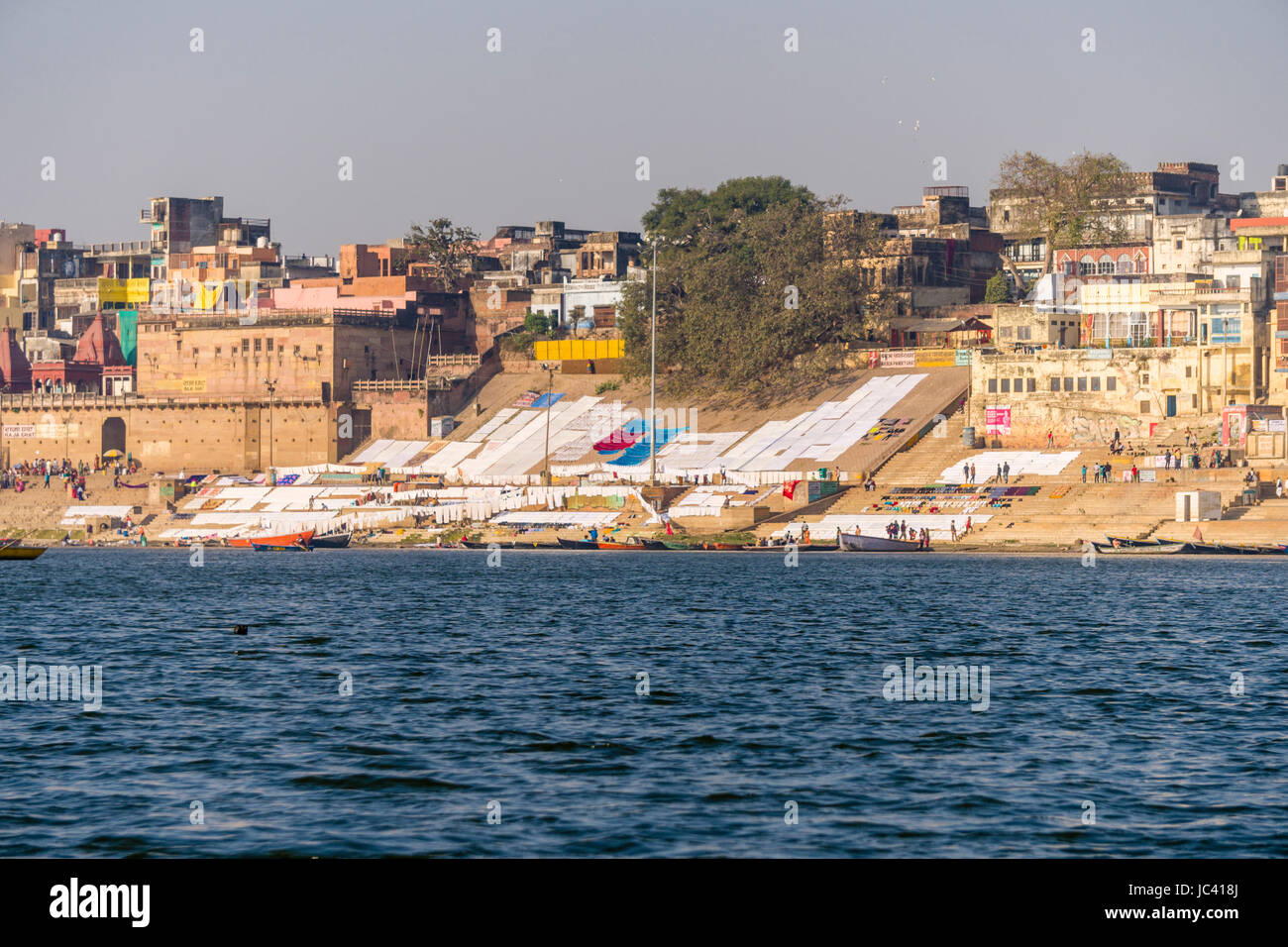 Panoramic view across the holy river Ganges on Pandey Ghat in the ...
