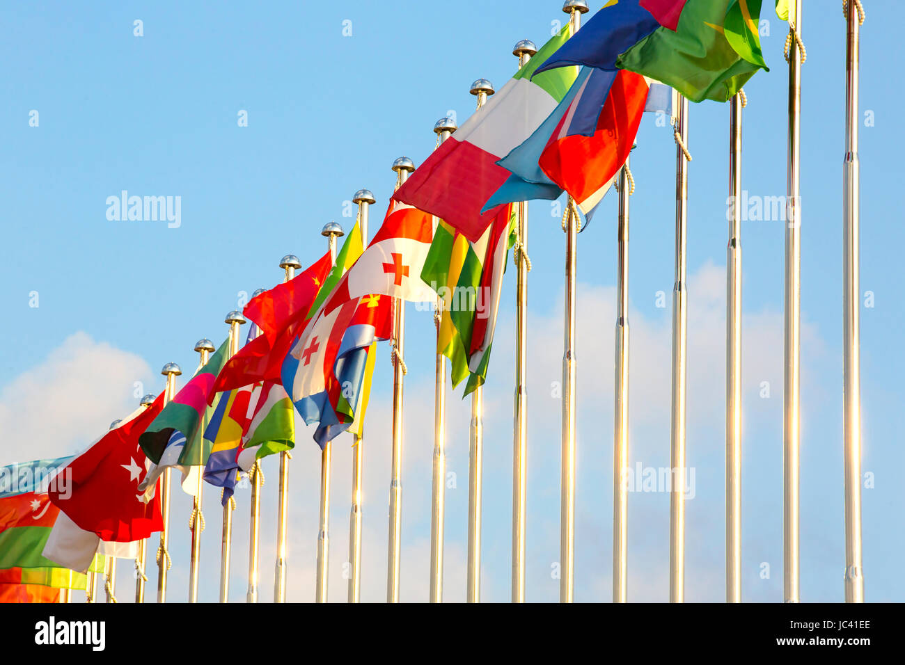 Different countries flags on flagpoles on the sky background Stock ...