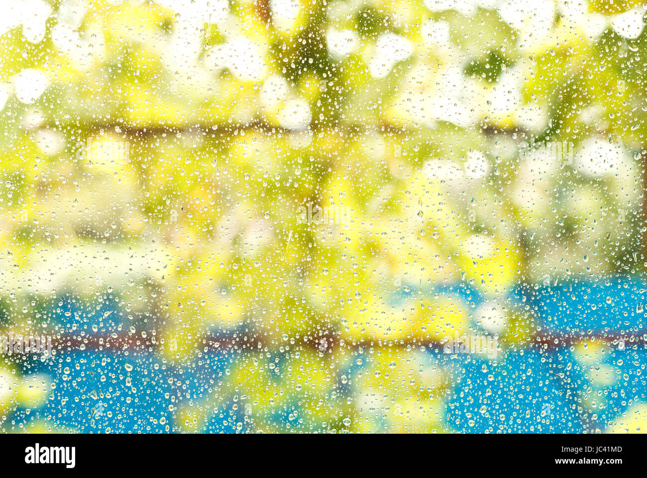 raindrops on window glass after summer rain background Stock Photo - Alamy