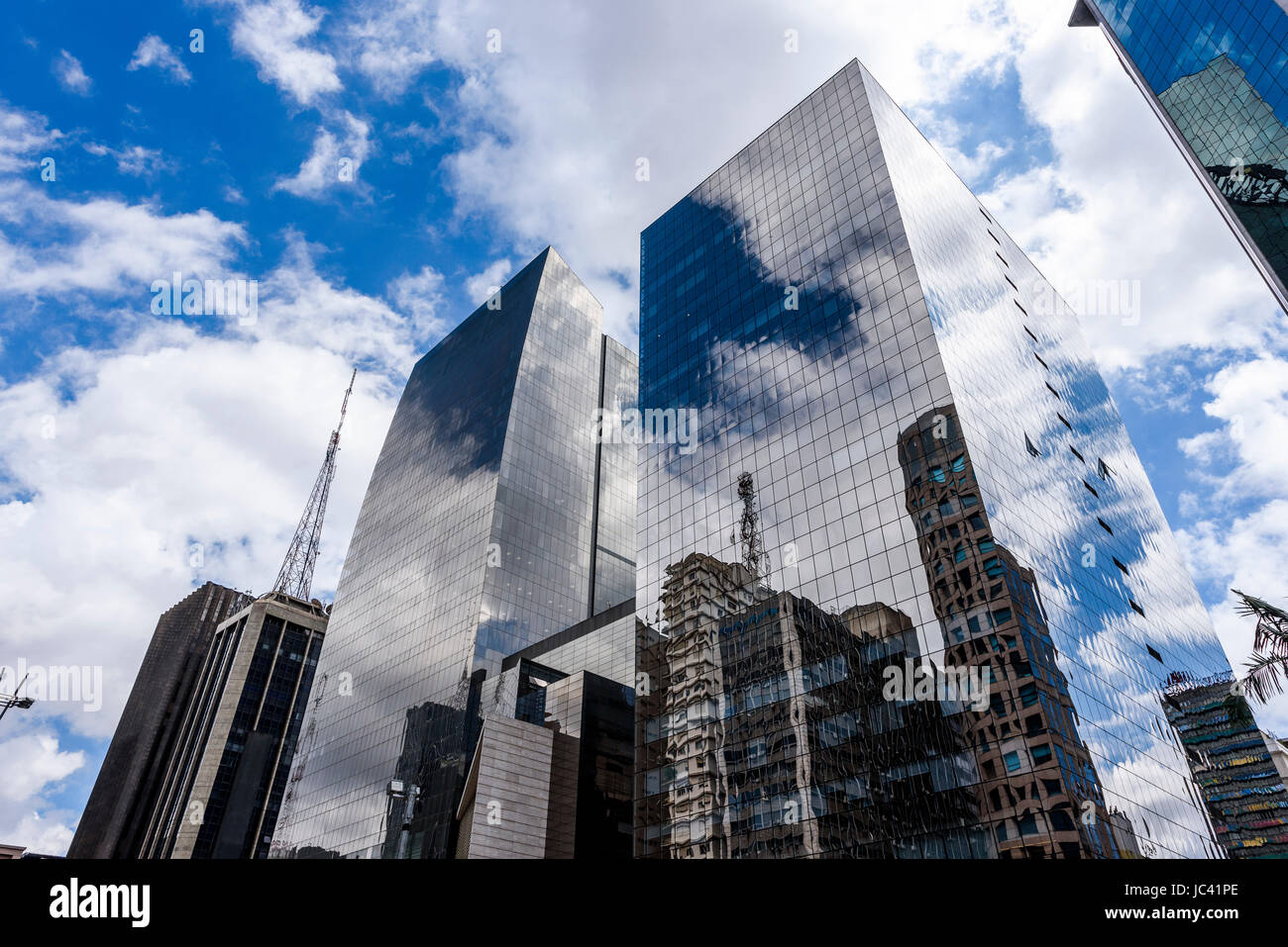 Clouds reflected on tall commercial buildings in Avenida Paulista ...