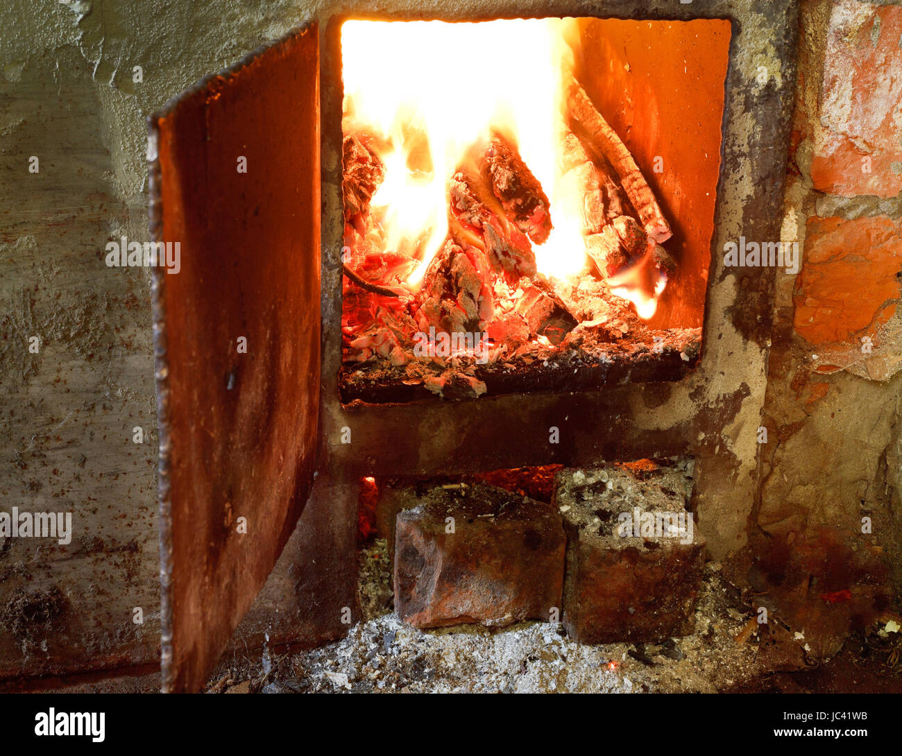 hot fire in furnace with open door close up Stock Photo - Alamy