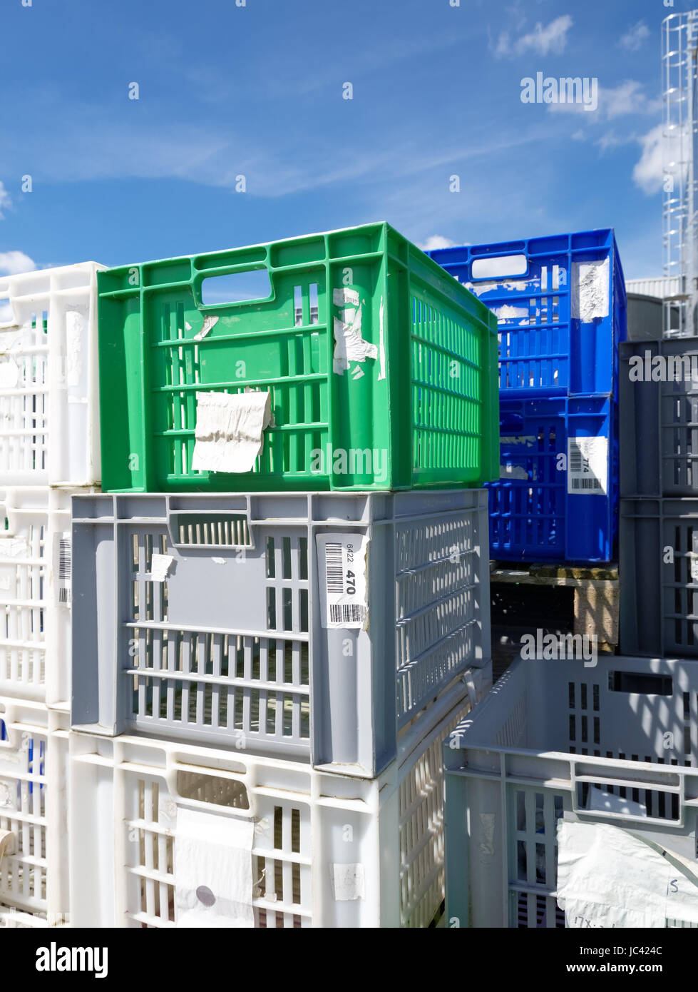 piled up empty plastic crates on an industrial area Stock Photo - Alamy