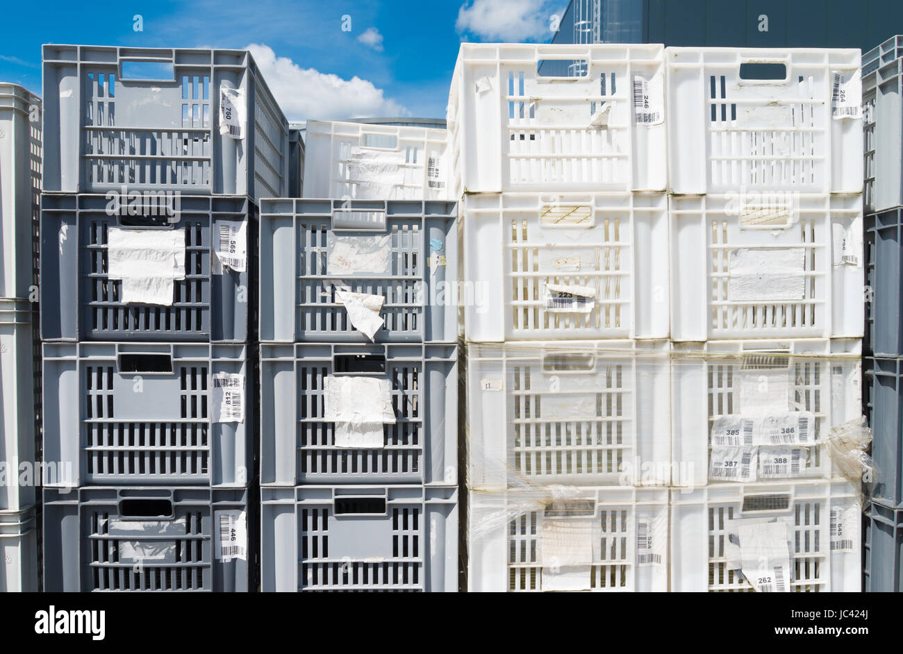 piled up empty plastic crates on an industrial area Stock Photo - Alamy