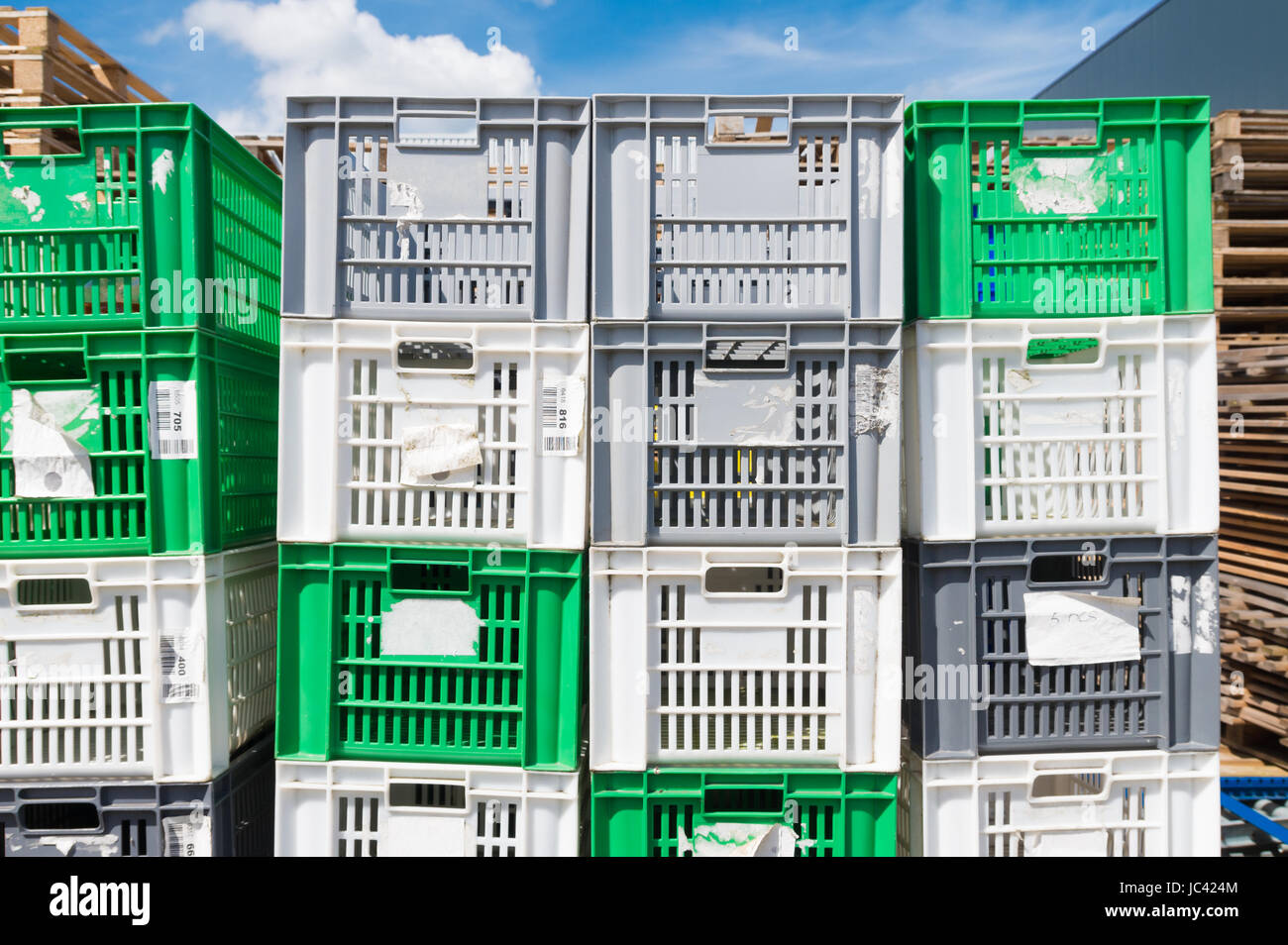 piled up empty plastic crates on an industrial area Stock Photo - Alamy