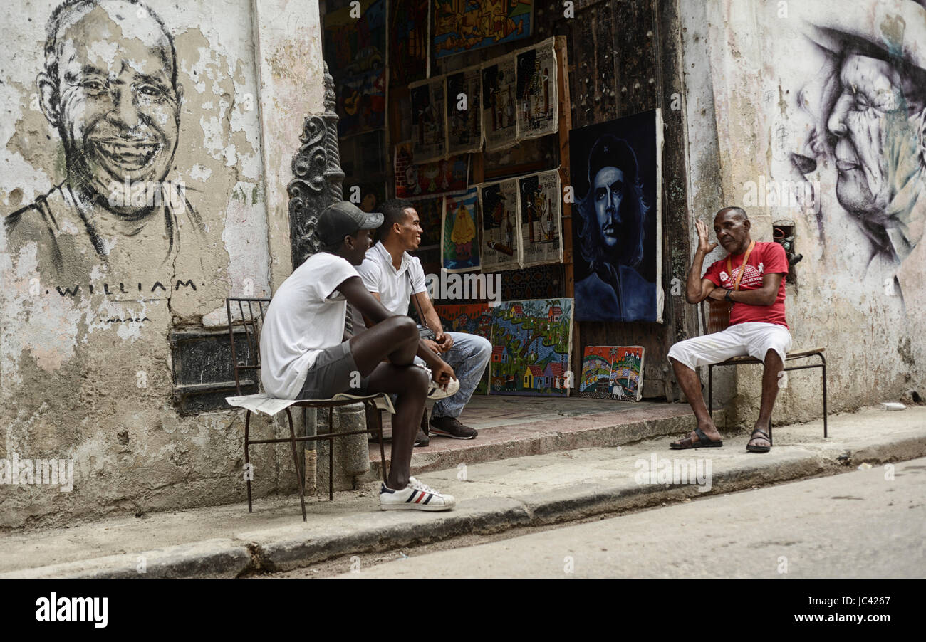 Men sitting outside shop hi-res stock photography and images - Alamy