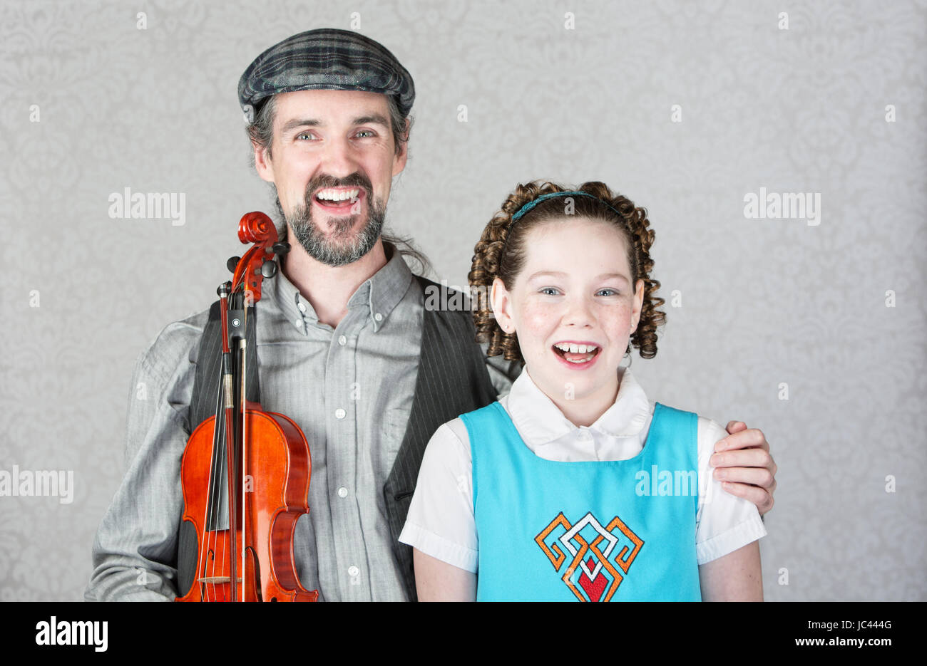 Happy irish folk musician and child laughing together Stock Photo - Alamy