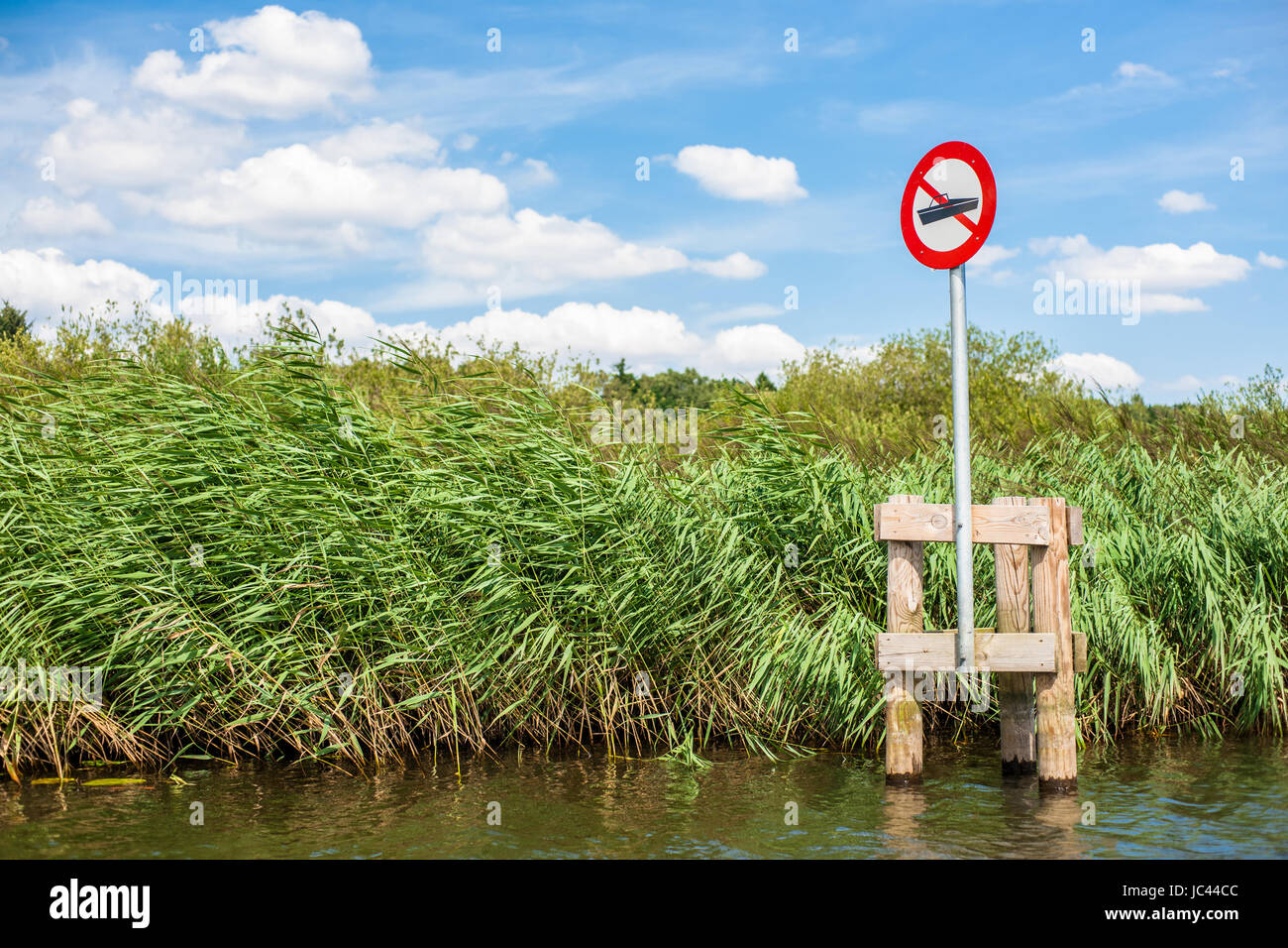 Lake scenery with a red no boating sign Stock Photo - Alamy