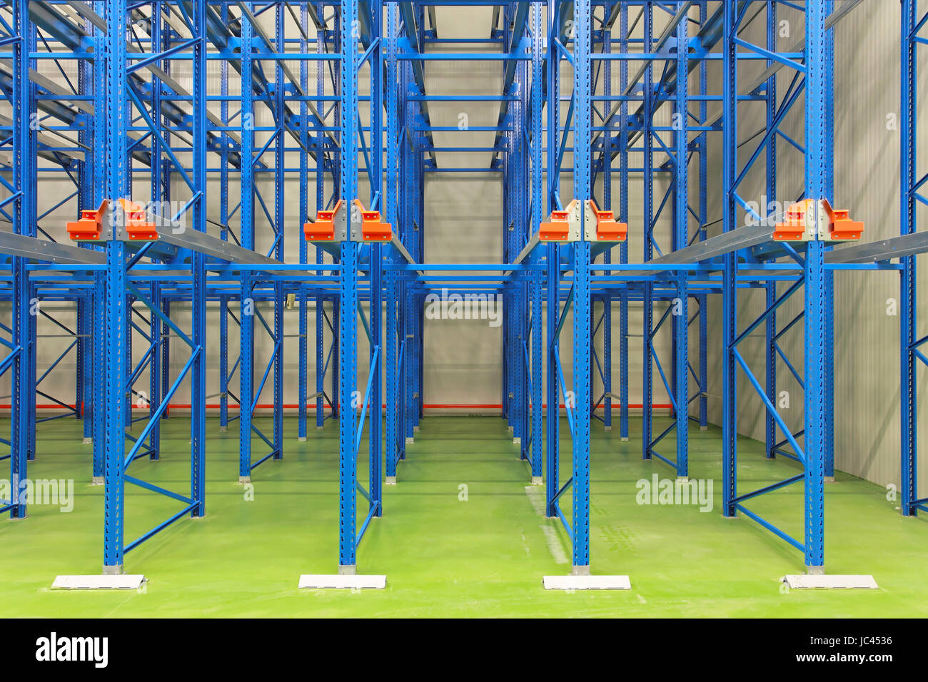 Blue shelving system in distribution warehouse Stock Photo - Alamy