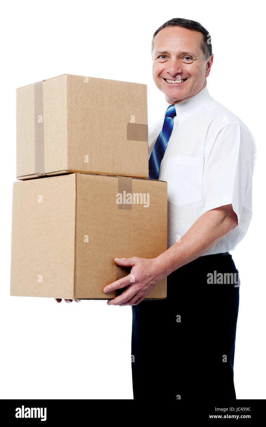 Smiling mature man carrying carton boxes Stock Photo - Alamy