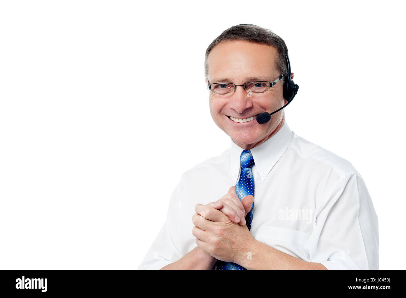 Senior call center executive posing with clasped hands Stock Photo - Alamy