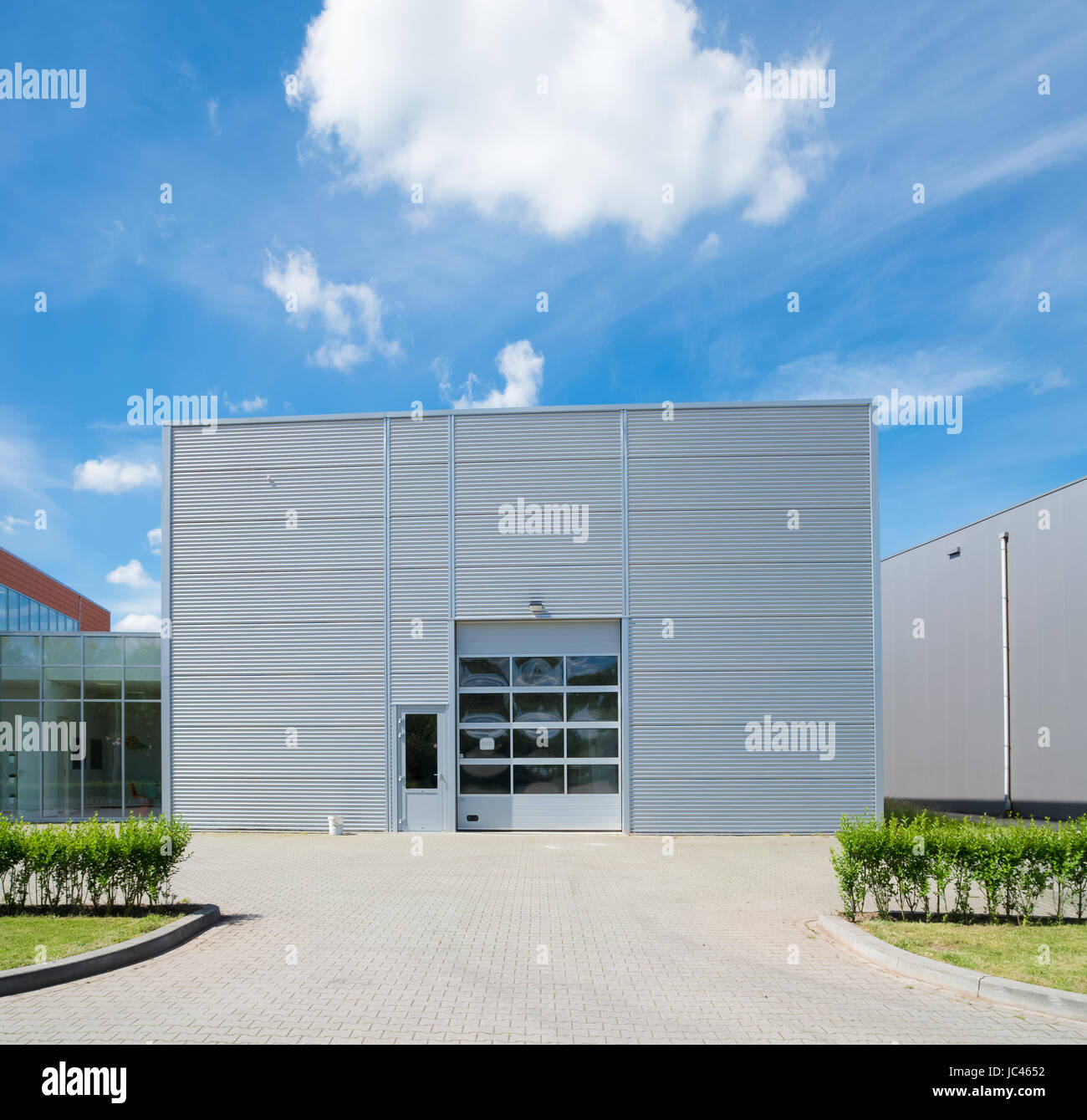modern industrial unit with roller doors Stock Photo - Alamy