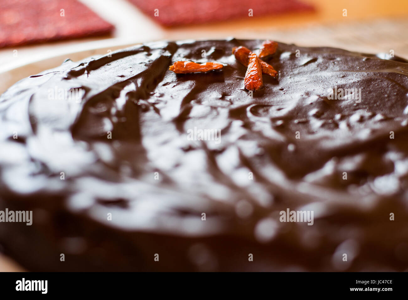Whole Spicy Chocolate Cake with Chilli Peppers Stock Photo - Alamy