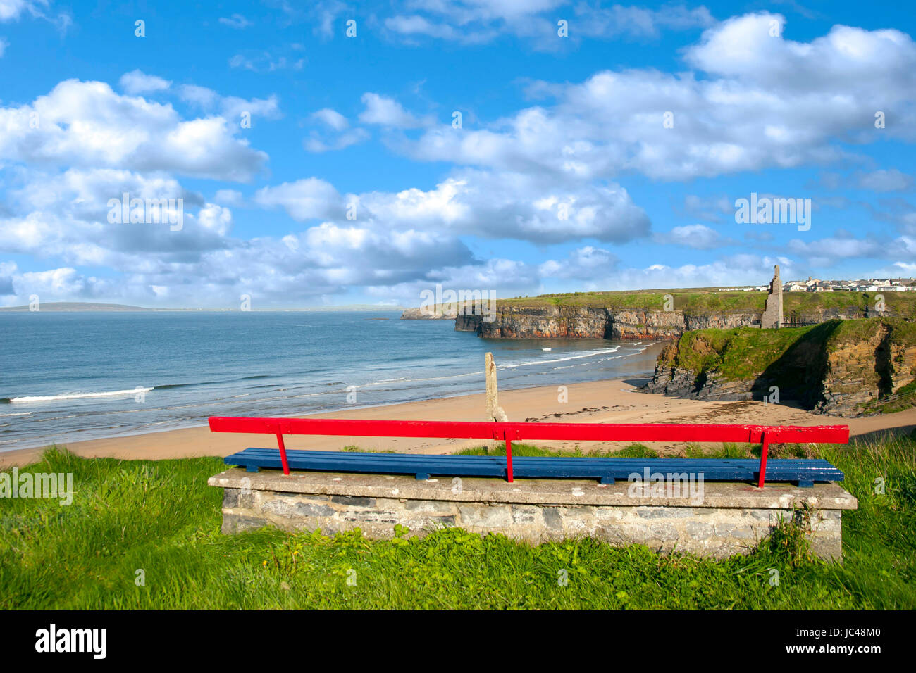 bench on a cliff edge with views of Ballybunion beach cliffs and castle ...