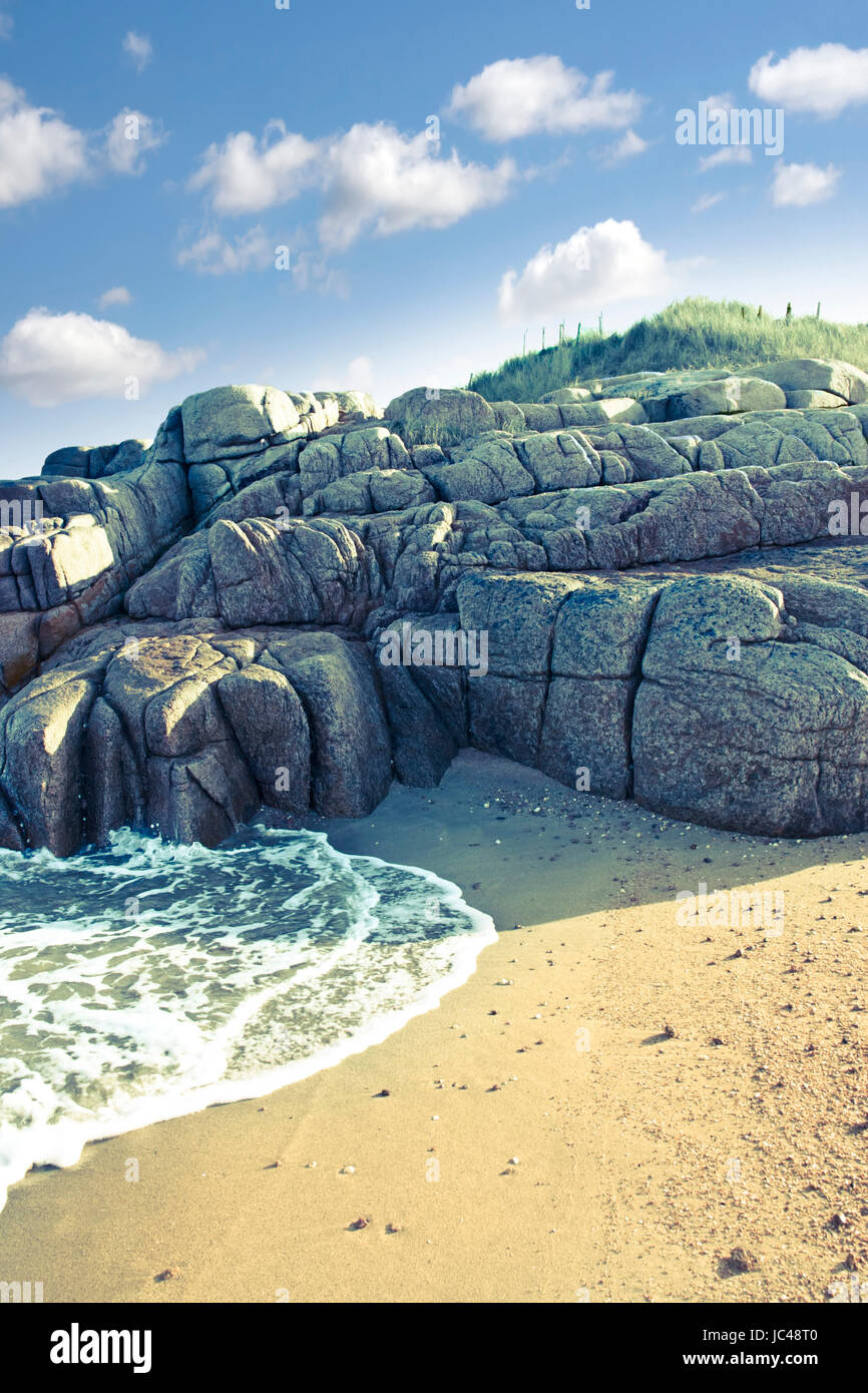 old natural rock formation on a coastal beach in county Donegal ...