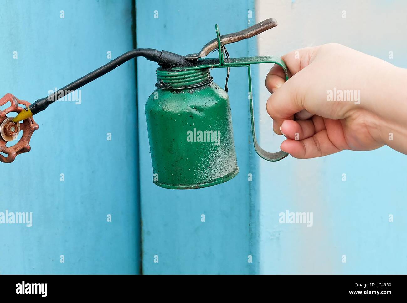 Hand Holding Old Vintage Oiler or Oil Can Coated in Grease and Dust ...
