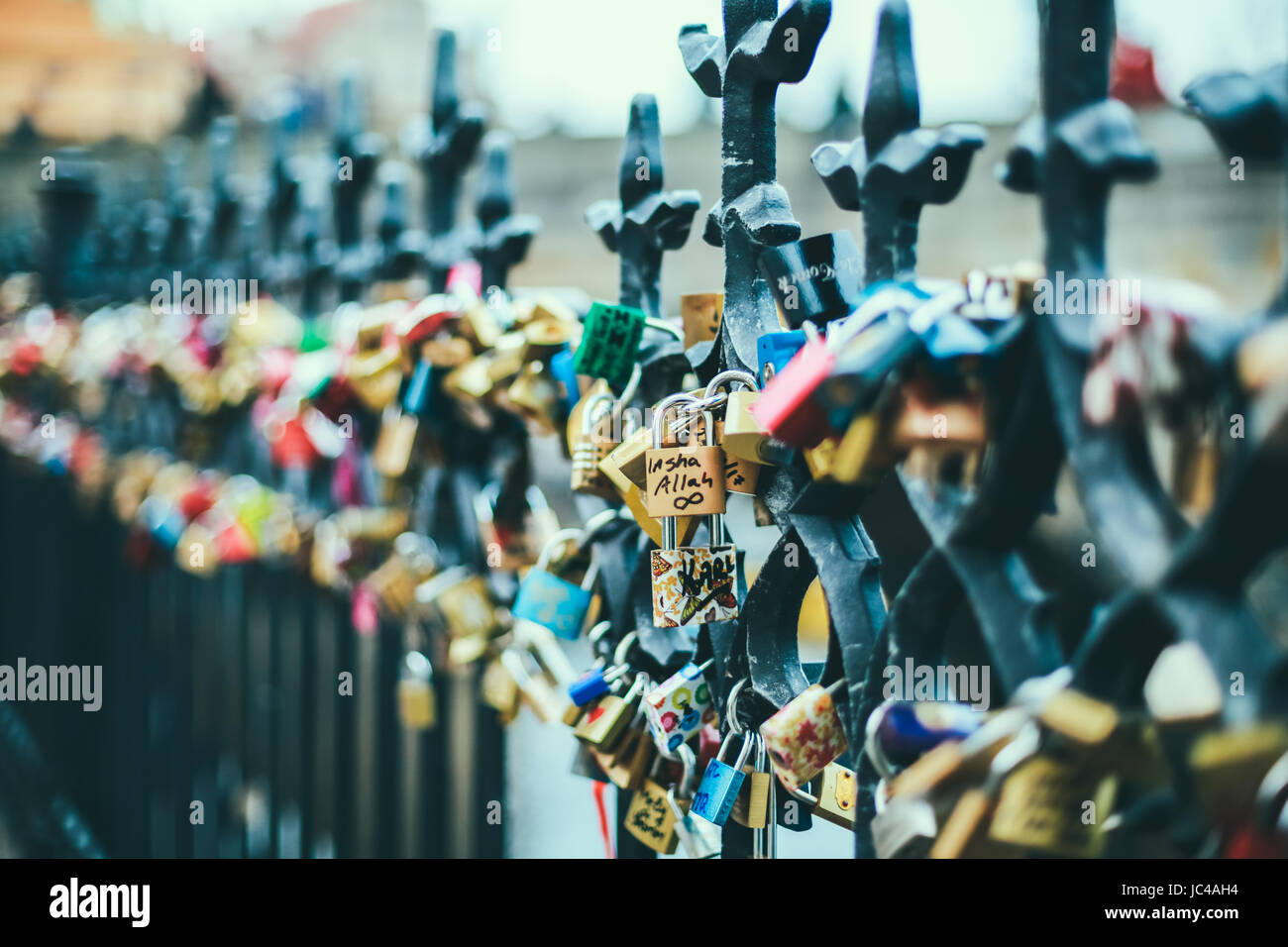 Love locks on a metal fence near Charles Bridge in Prague Stock Photo ...