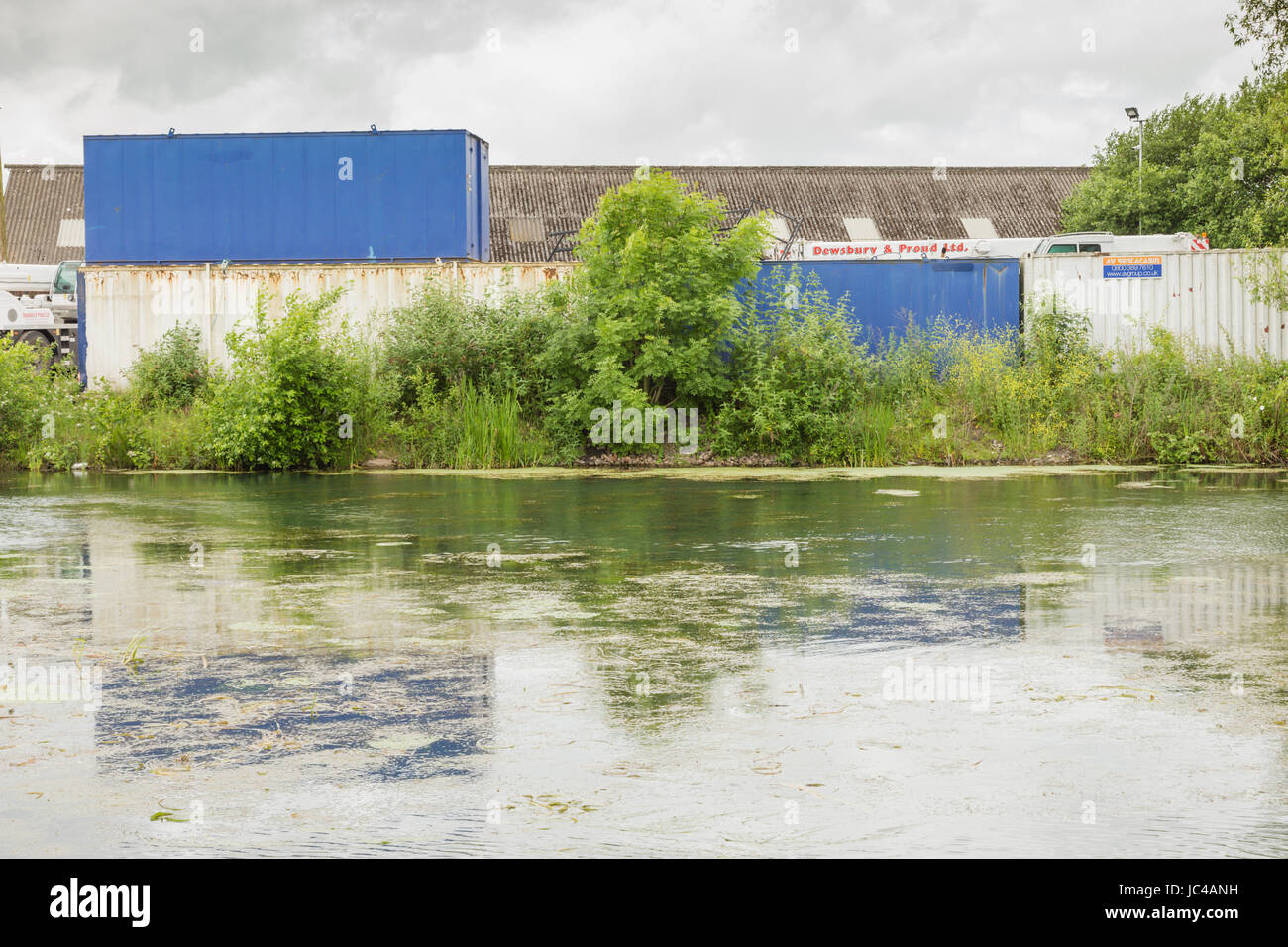 Rear view of light industry buildings by a canal, Coseley, West ...