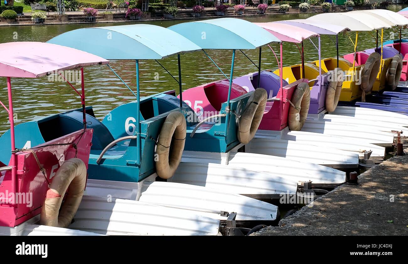 Row of Colorful Water Cycle Boats or Pedal Boats at The Dock in A Park ...