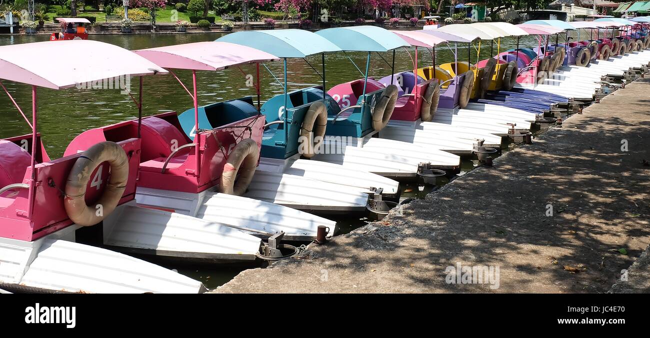 Row of Colorful Water Cycle Boats or Pedal Boats at The Dock in A Park ...