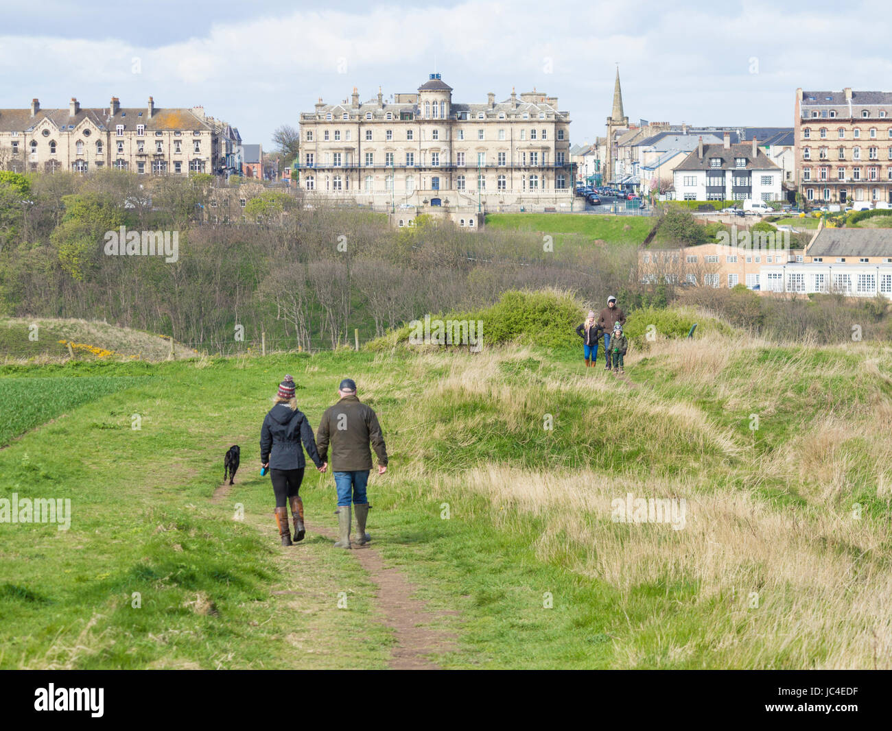 People walking on The Cleveland Way coastal footpath on cliffs near ...