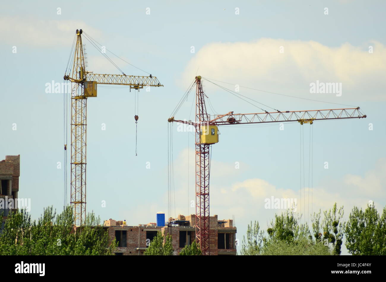 Construction of the new building tower crane Stock Photo - Alamy