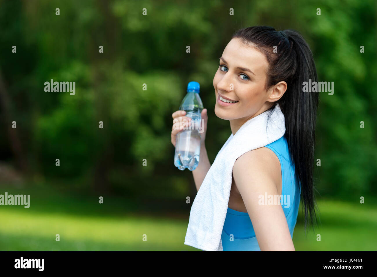 Young woman with bottle of water Stock Photo - Alamy
