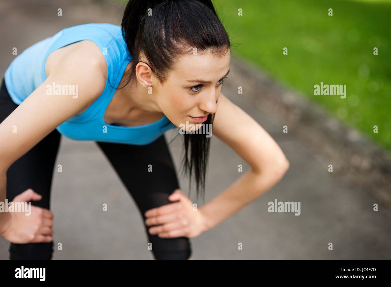 Tired woman after jogging Stock Photo - Alamy