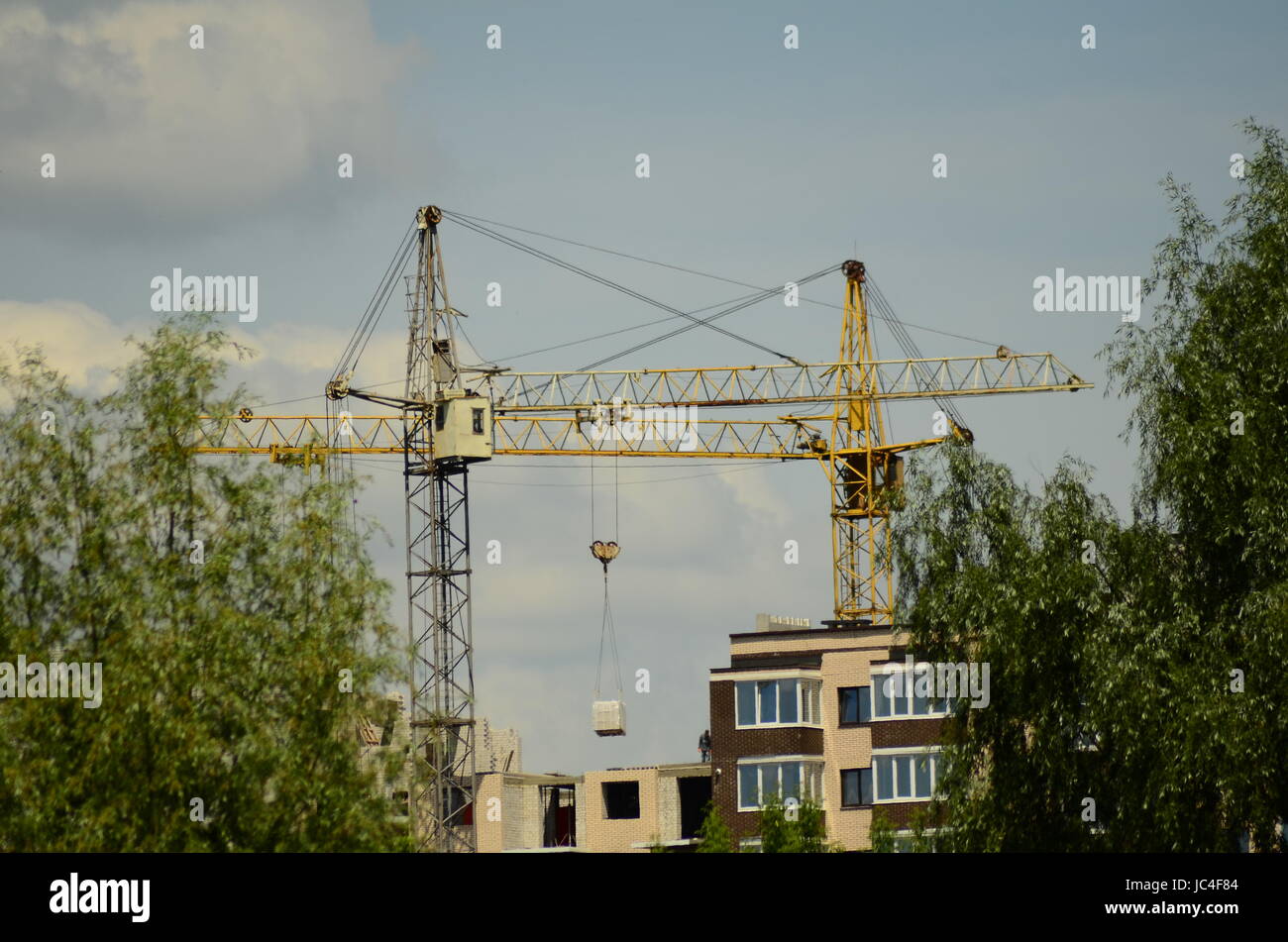 Construction of the new building tower crane Stock Photo - Alamy