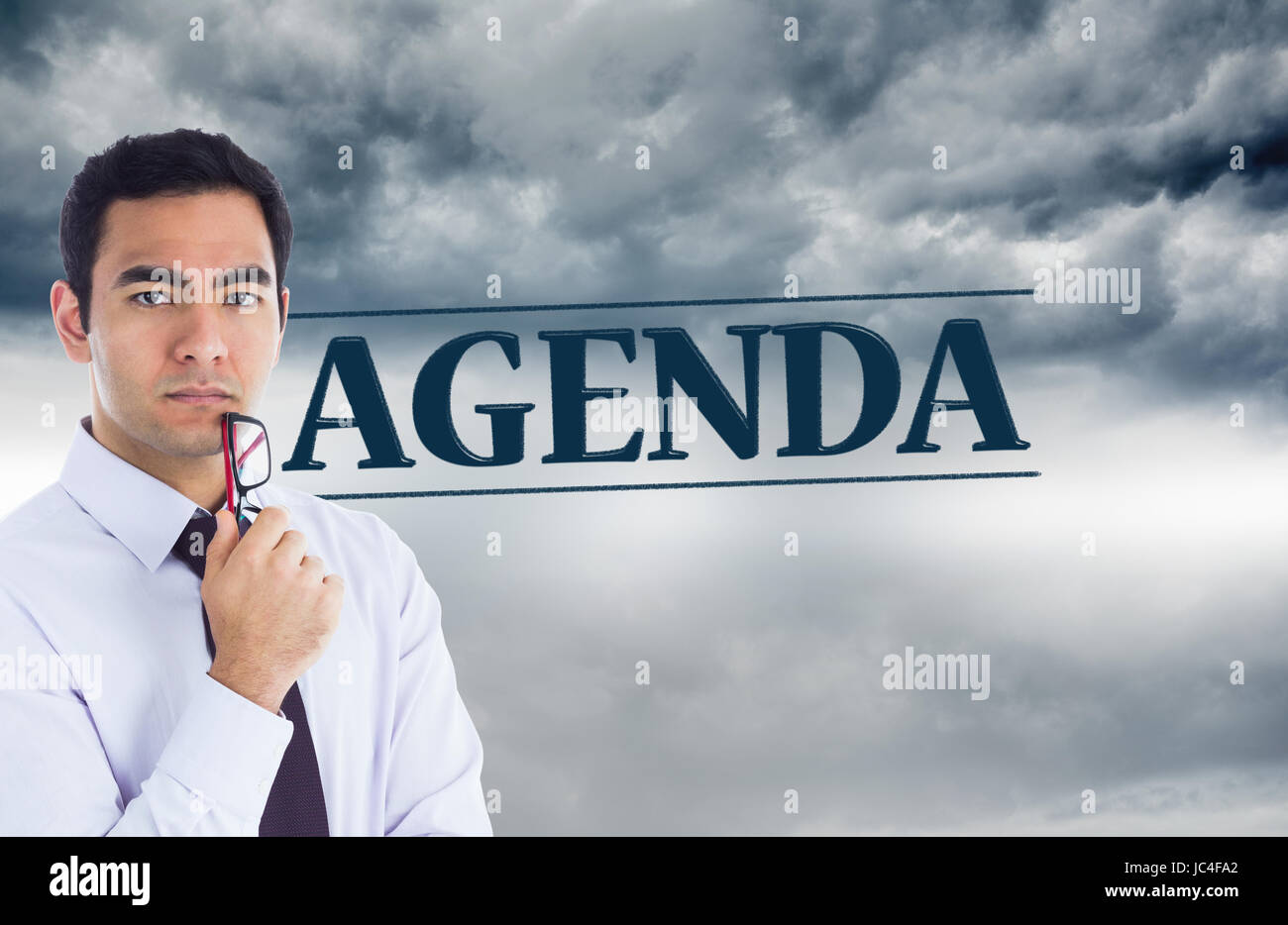 Composite image of unsmiling businessman holding glasses Stock Photo ...