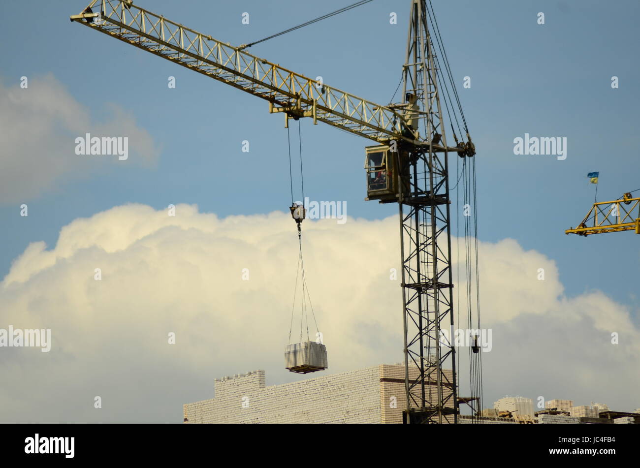 Construction of the new building tower crane Stock Photo - Alamy