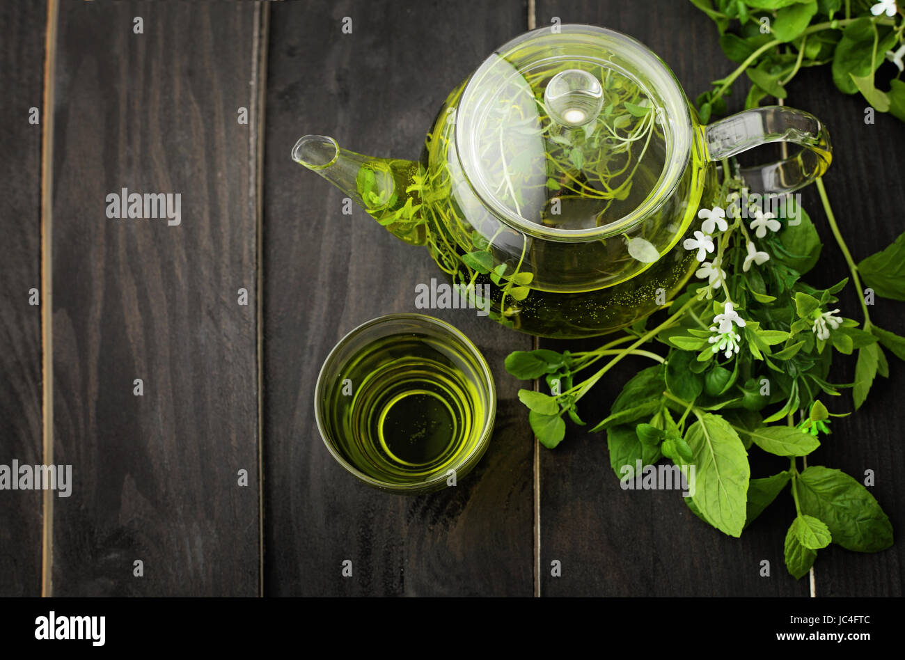 healthy green tea cup with tea leaves Stock Photo - Alamy