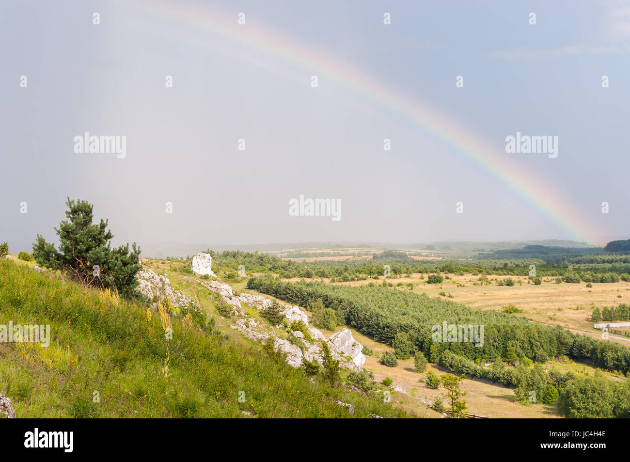 Rural landscape with rain and rainbow over fields Stock Photo - Alamy