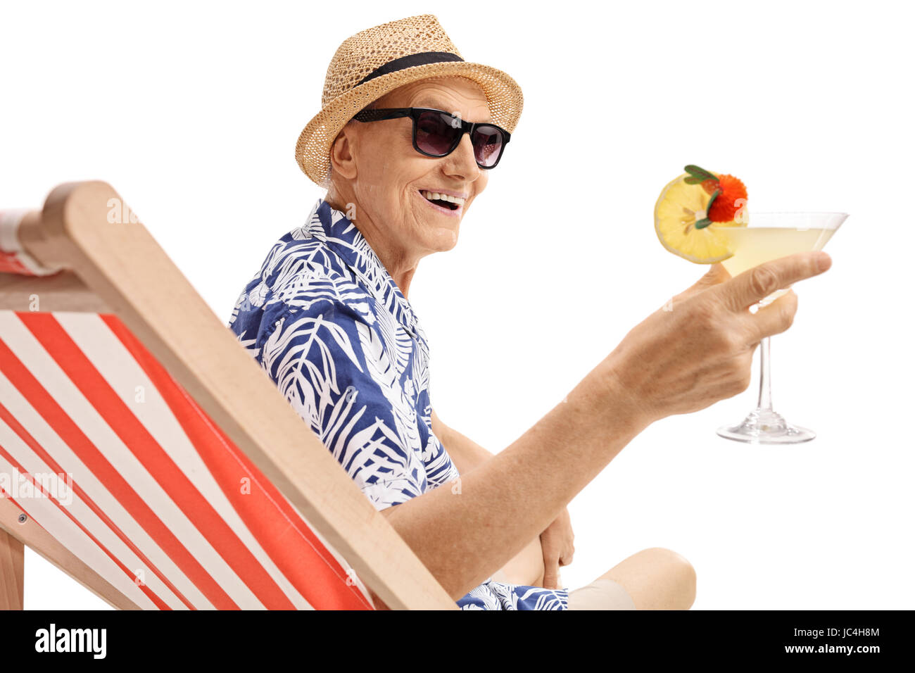 Elderly tourist with a cocktail sitting on a sun lounger isolated on ...