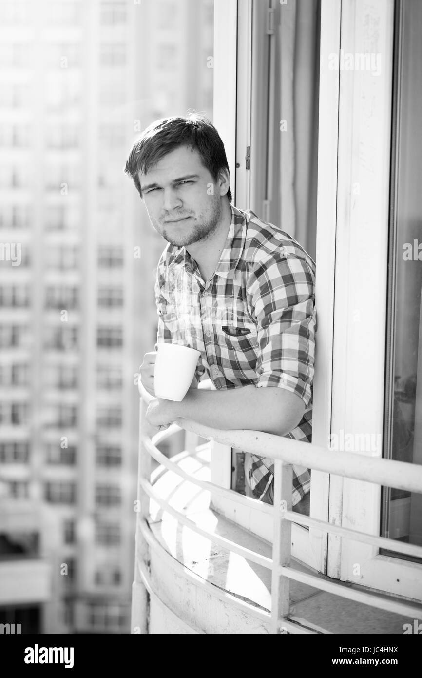 Person on balcony thinking Black and White Stock Photos & Images - Alamy