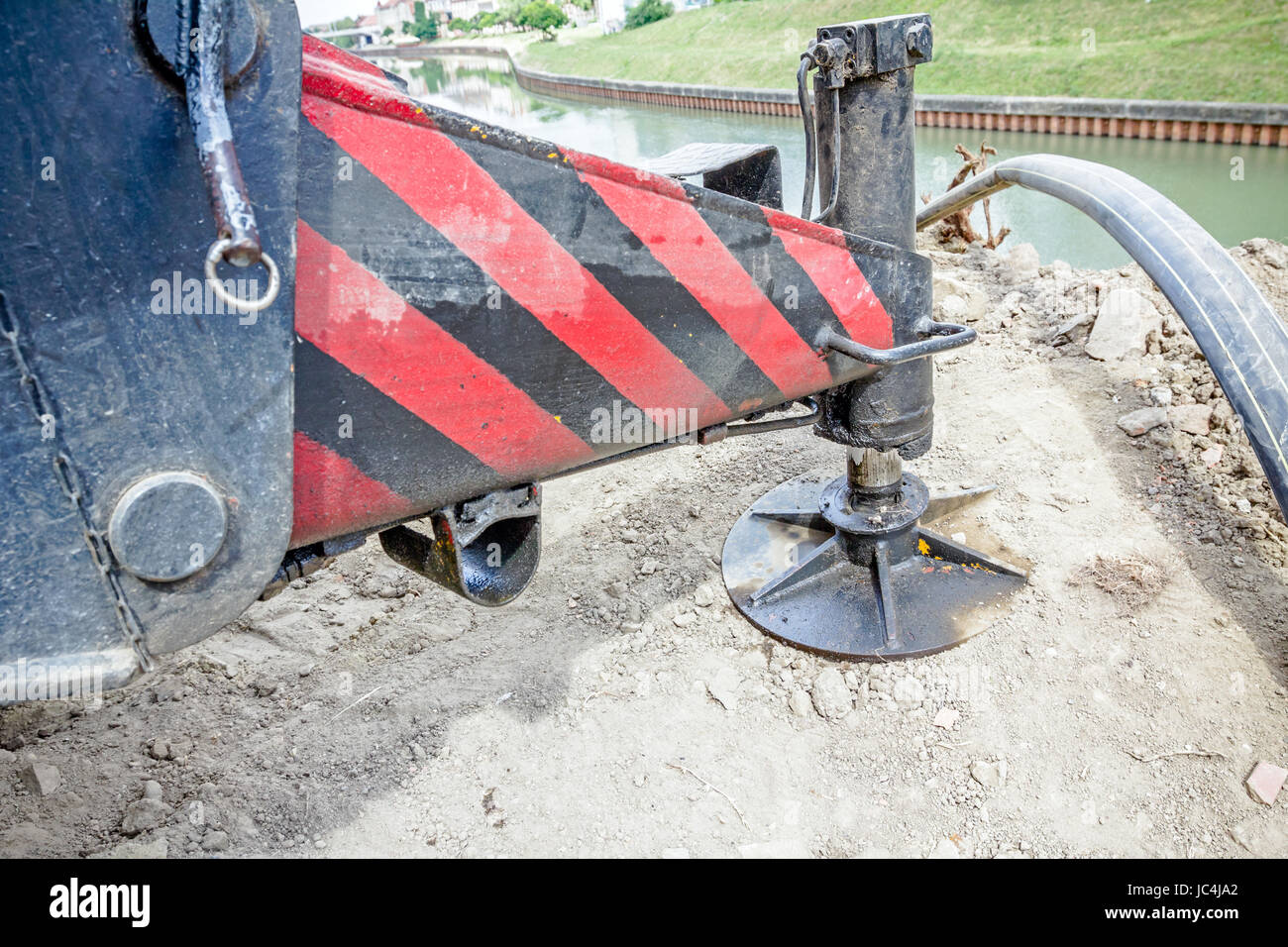 Extended side hydraulic outrigger to increase crane stability until is ...